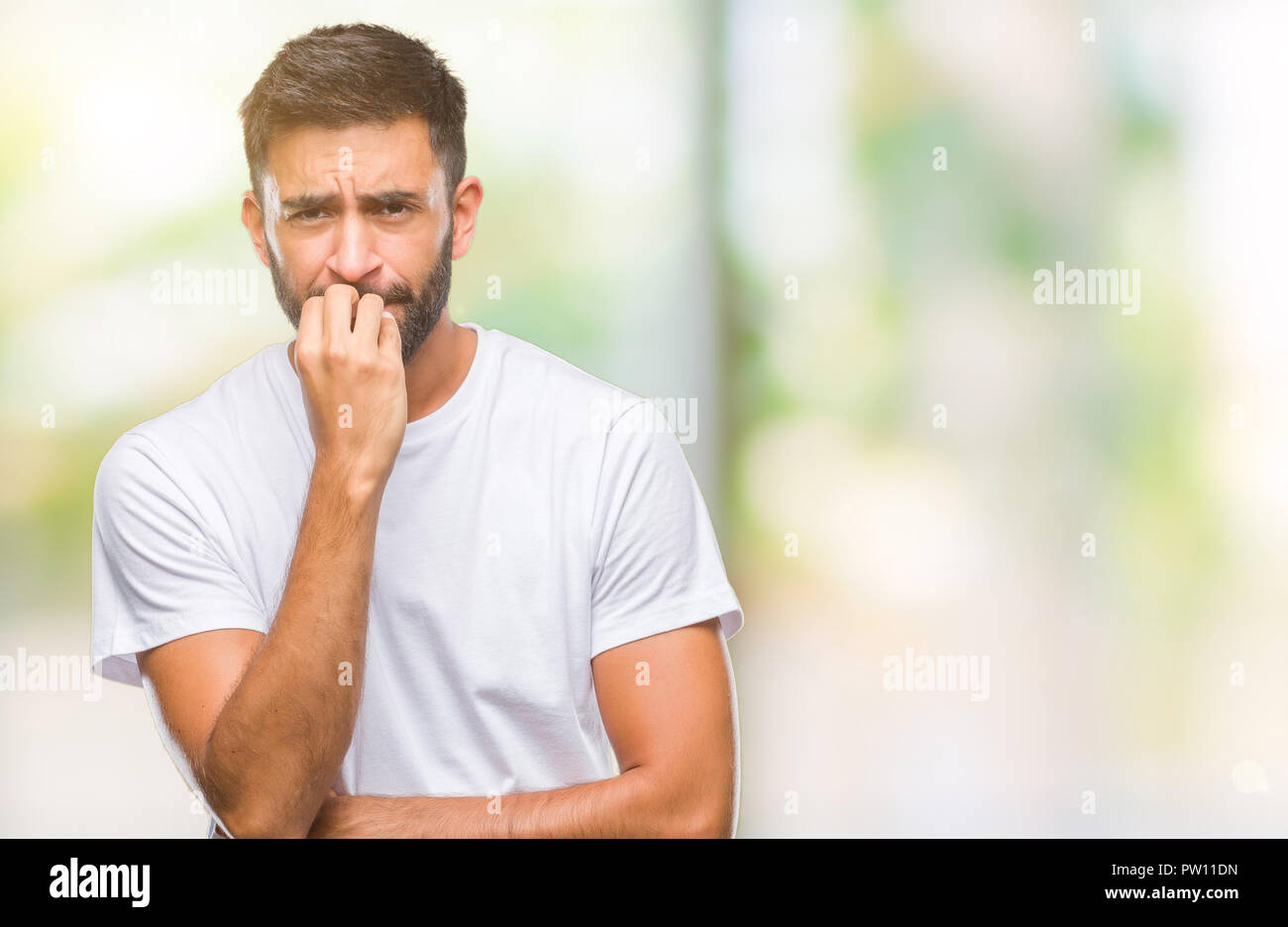 Adult hispanic man over isolated background looking stressed and ...