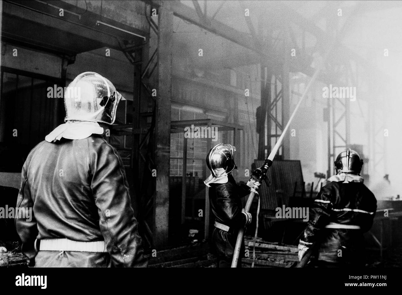 Archives 90ies: Firefighters at work in a burning factory, Lyon, France ...