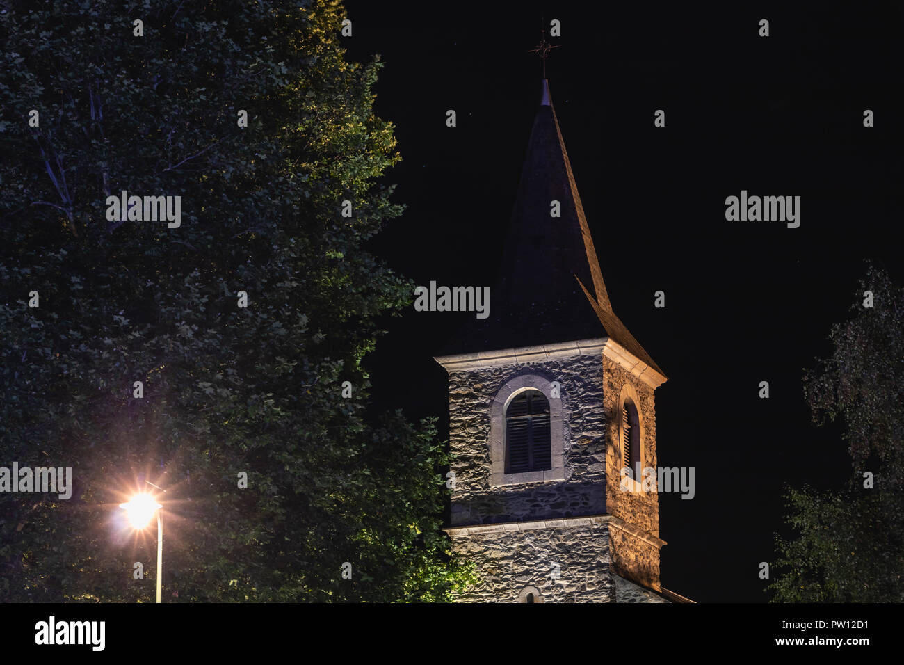 architectural detail of the Sainte Marie chapel at night in Saint Lary ...