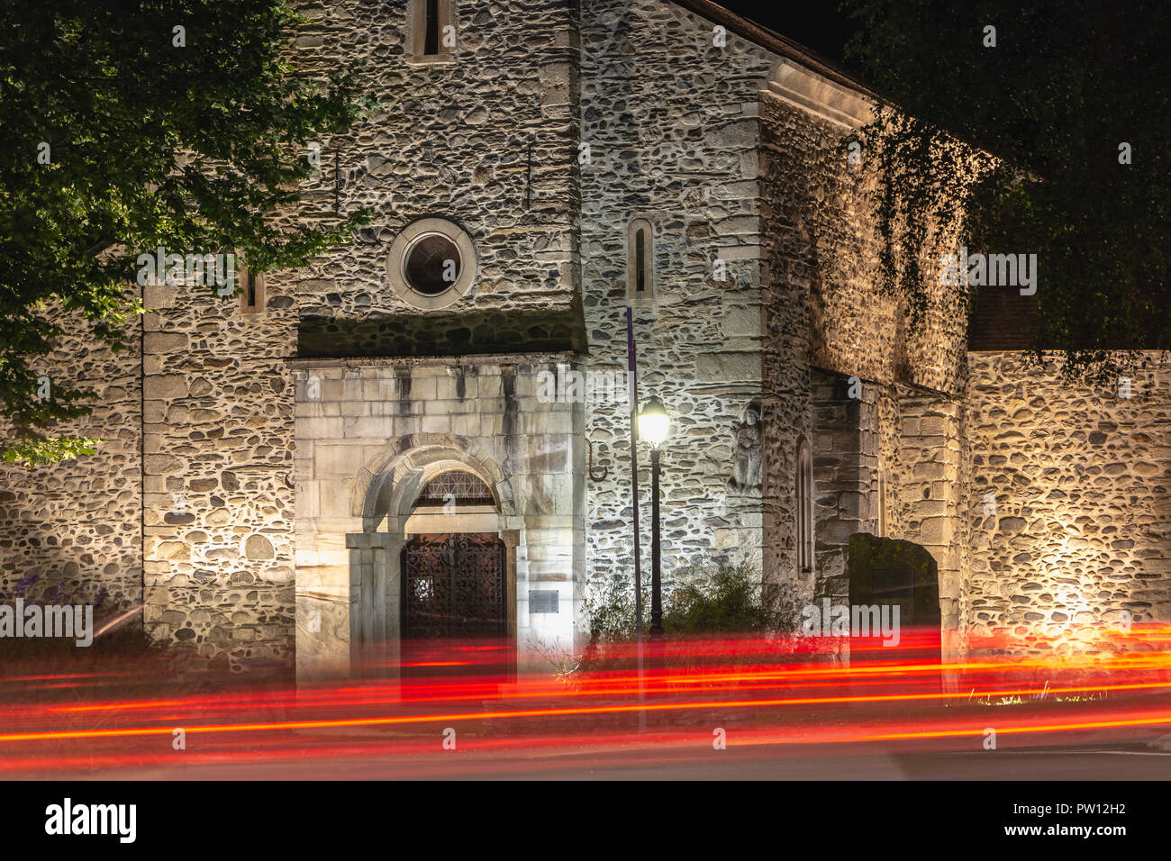 architectural detail of the Sainte Marie chapel at night in Saint Lary ...