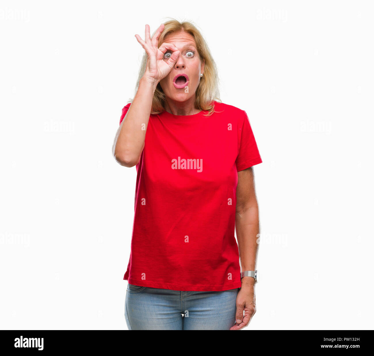 Middle age blonde woman over isolated background doing ok gesture ...