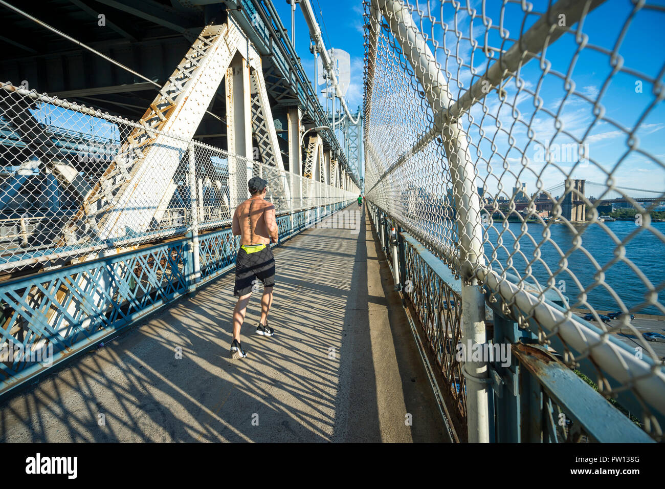 NEW YORK CITY - CIRCA AUGUST 2018: A young man jogs across the ...