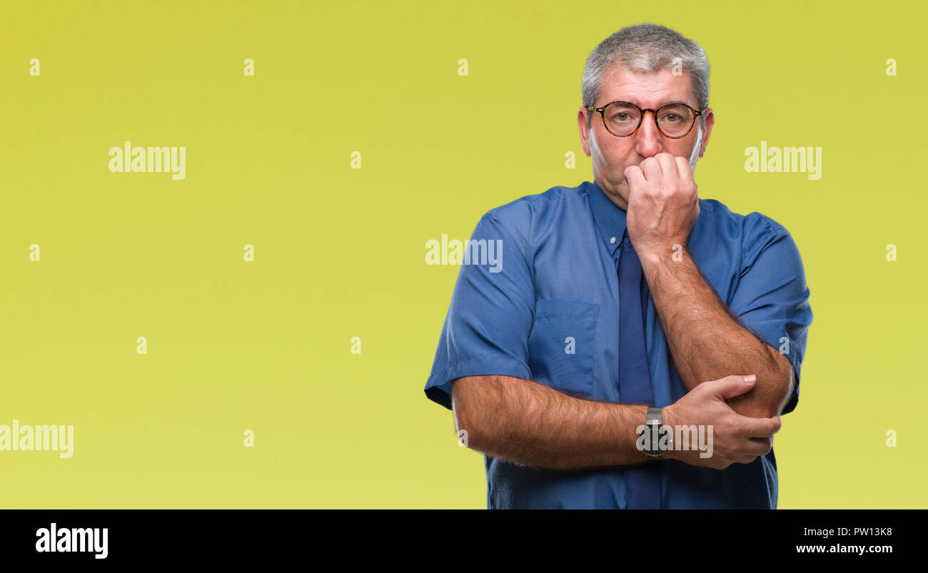 Handsome senior business man over isolated background looking stressed ...