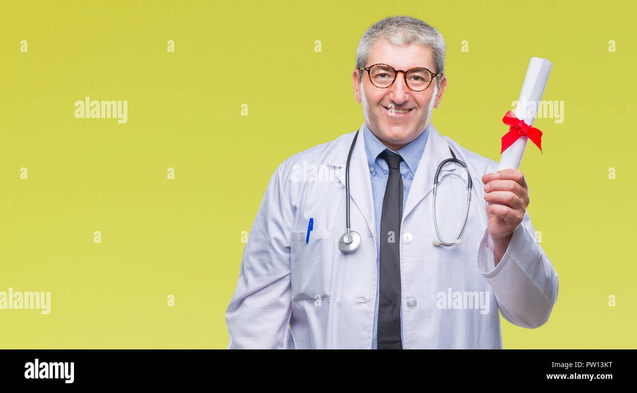 Handsome senior doctor man holding degree paper over isolated ...