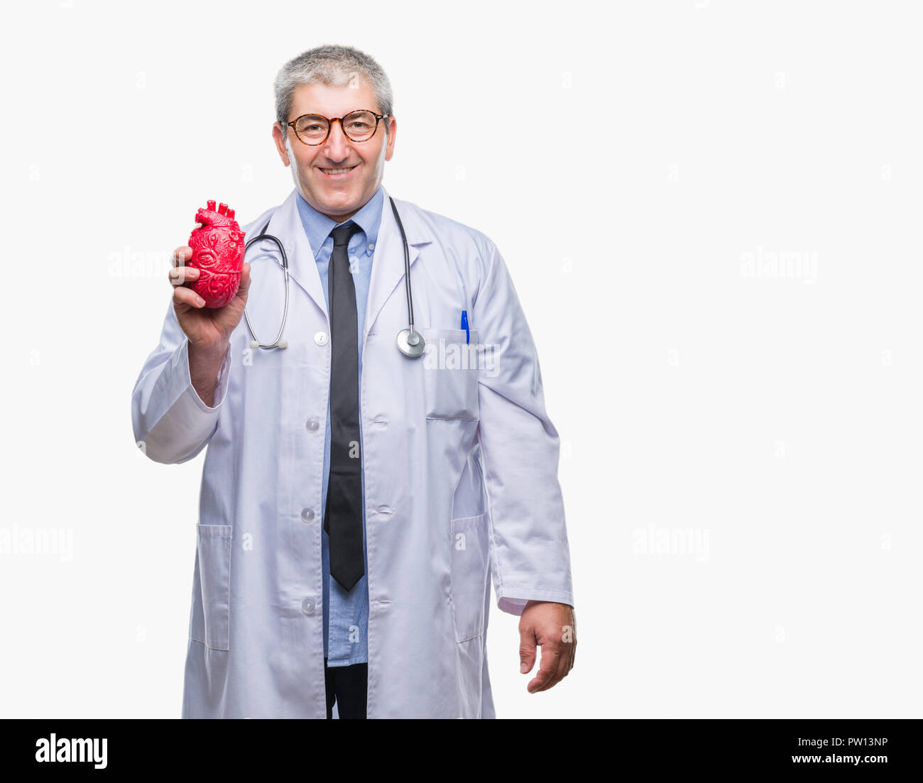 Handsome senior cardiologist doctor man holding heart over isolated ...