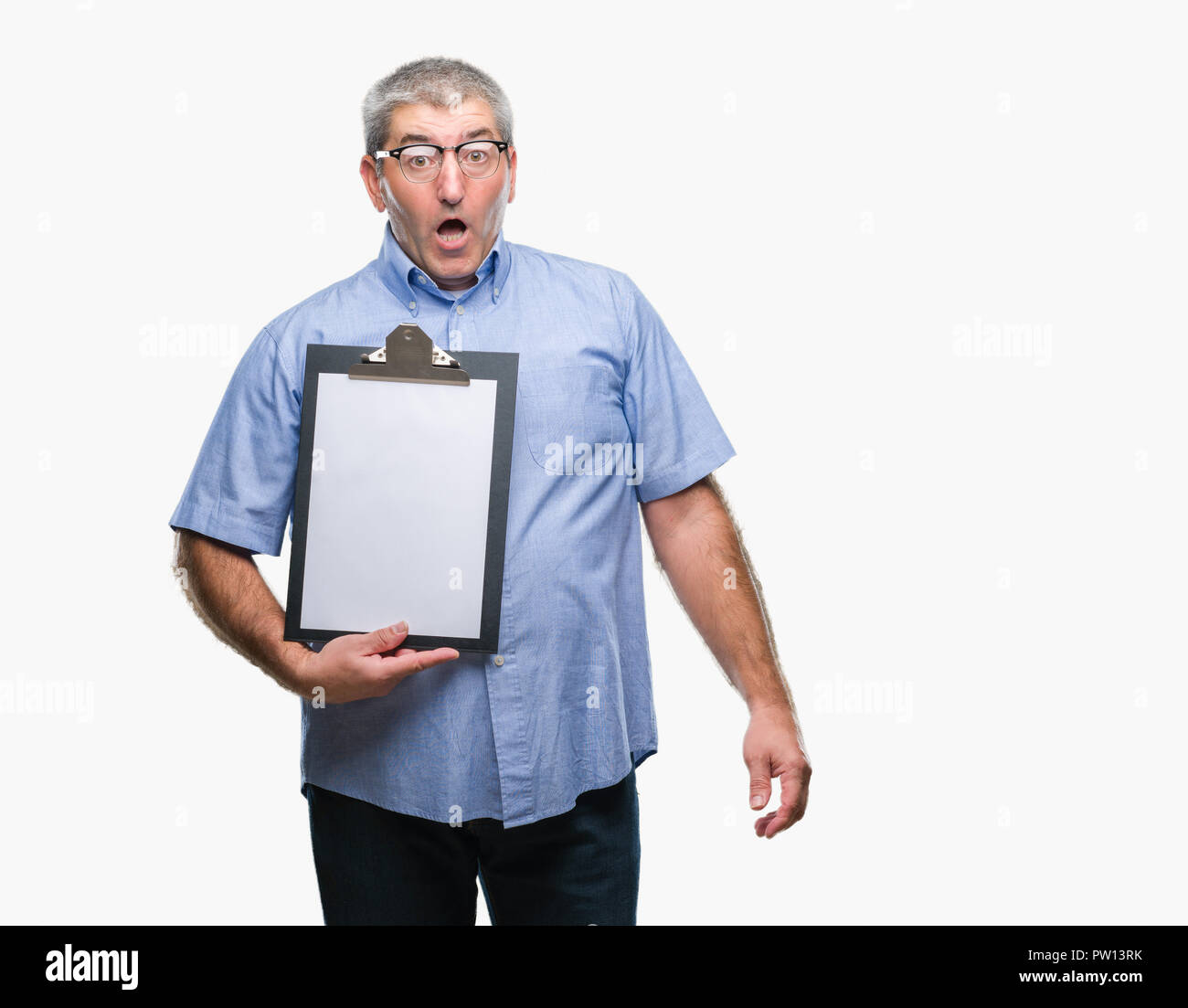 Handsome senior inspector man holding clipboard over isolated ...