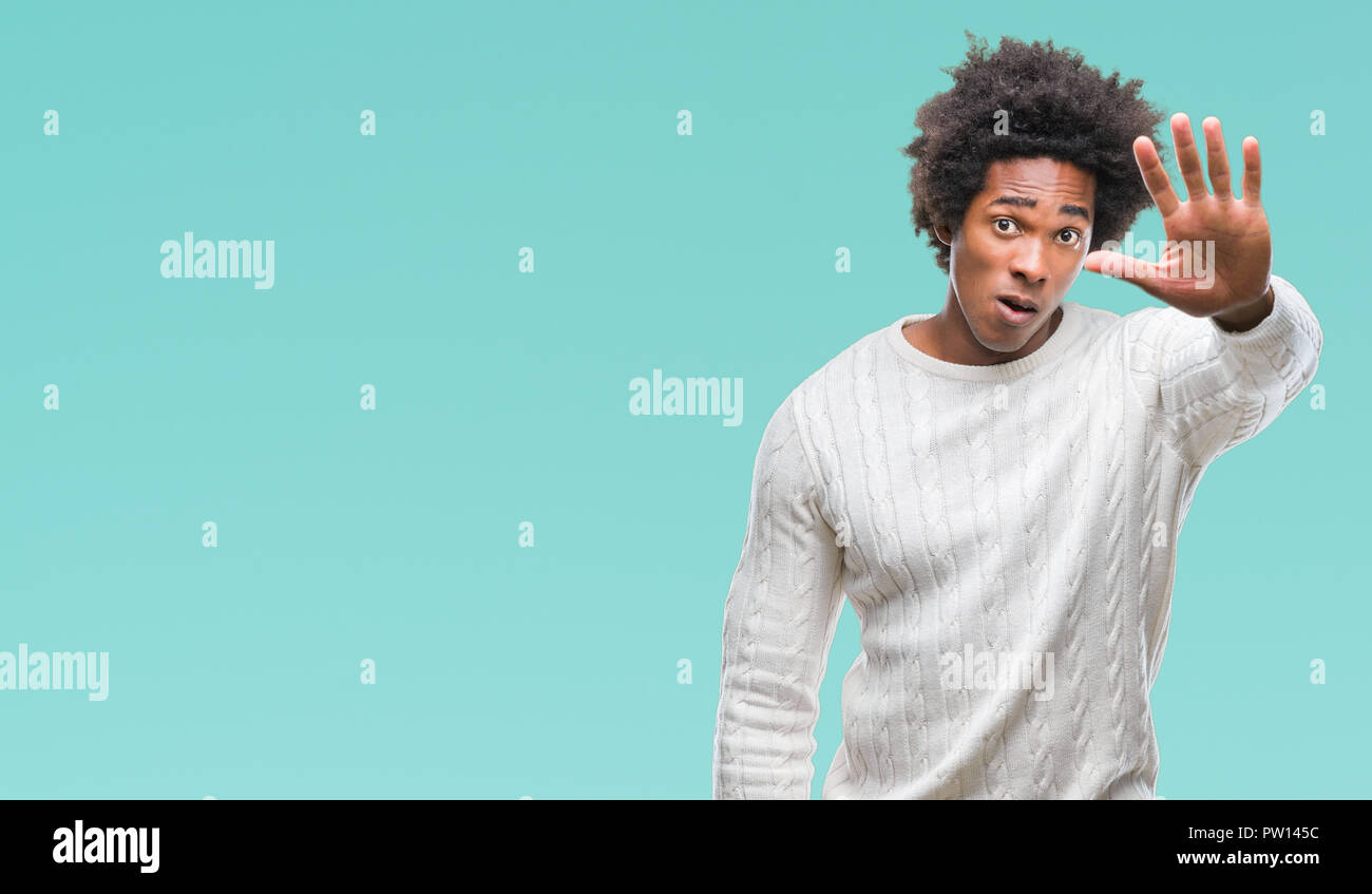 Afro american man over isolated background doing stop sing with palm of ...