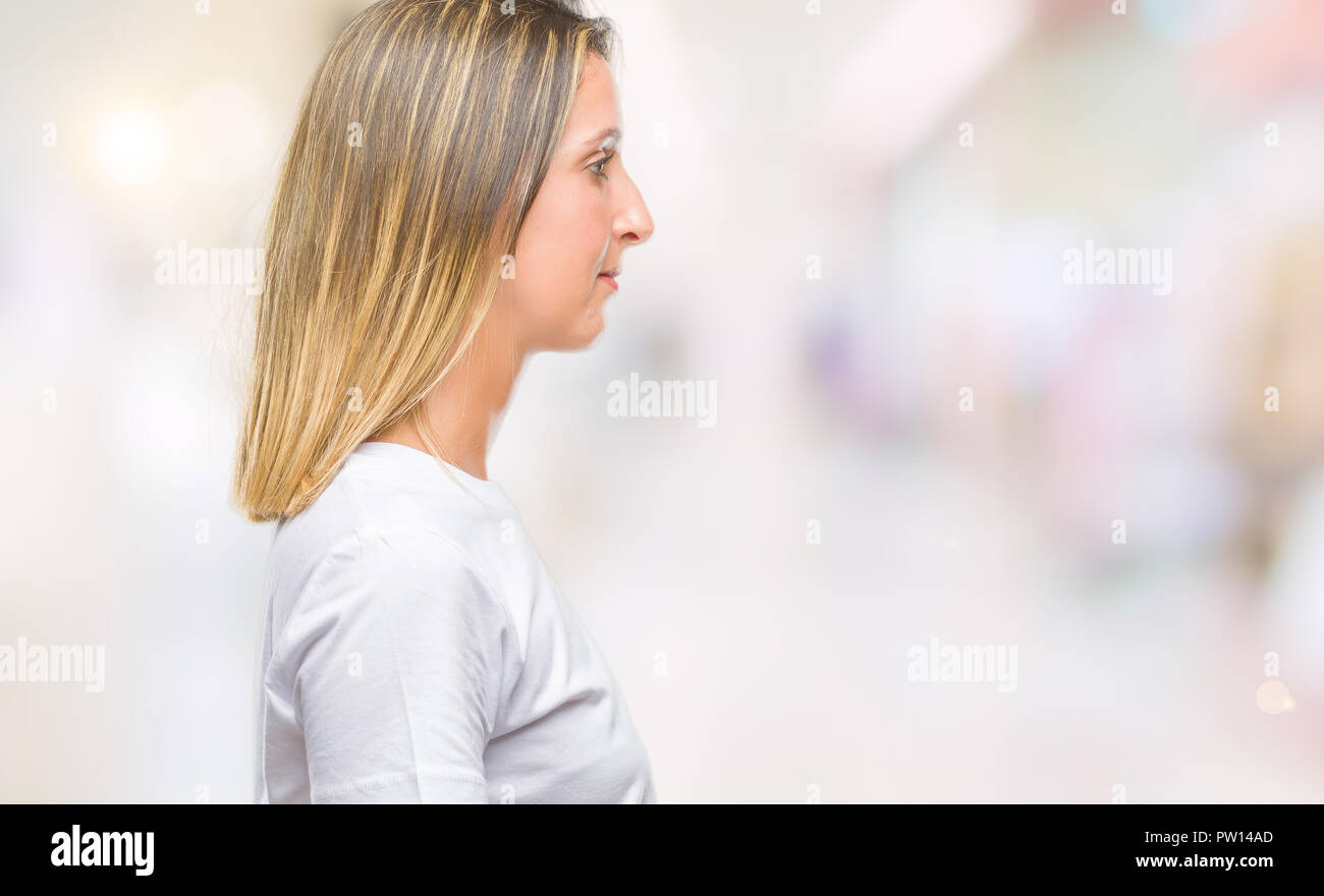 Young beautiful woman over isolated background looking to side, relax ...
