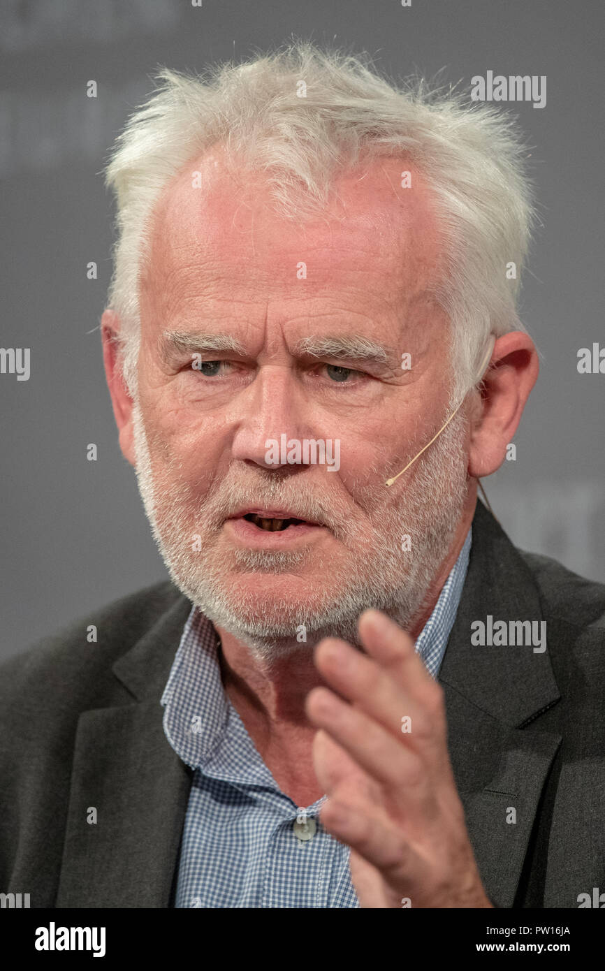Passau, Bavaria. 11th Oct, 2018. Jim Rakete, photographer, sits on ...