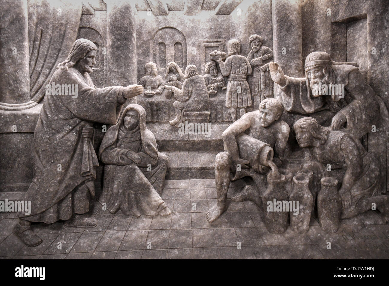 A relief sculpture of Jesus' miracle of turning water into wine in the ...