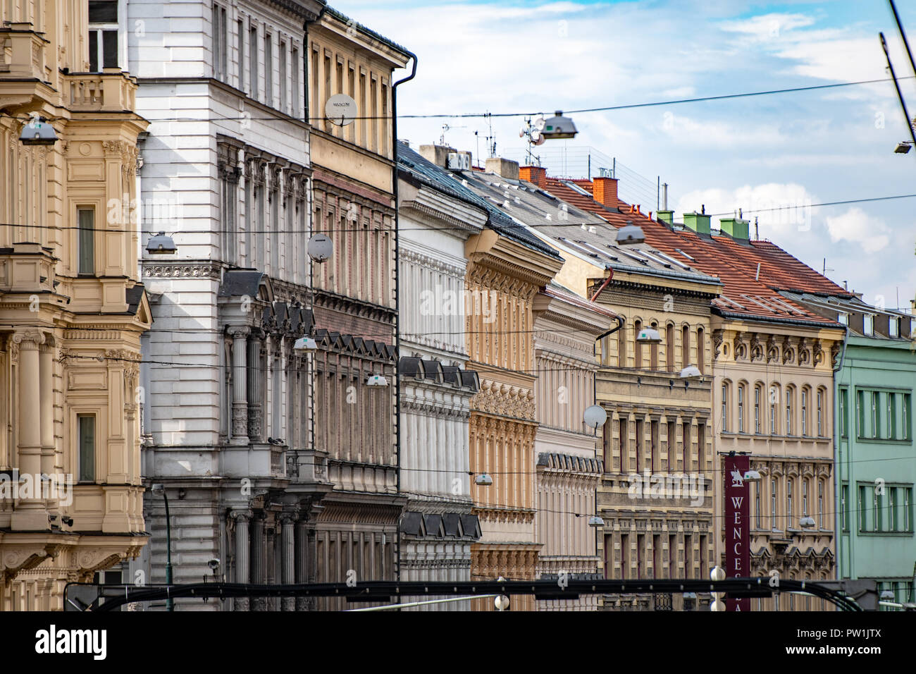 Side view of colorful buildings and windows with skyline in background ...