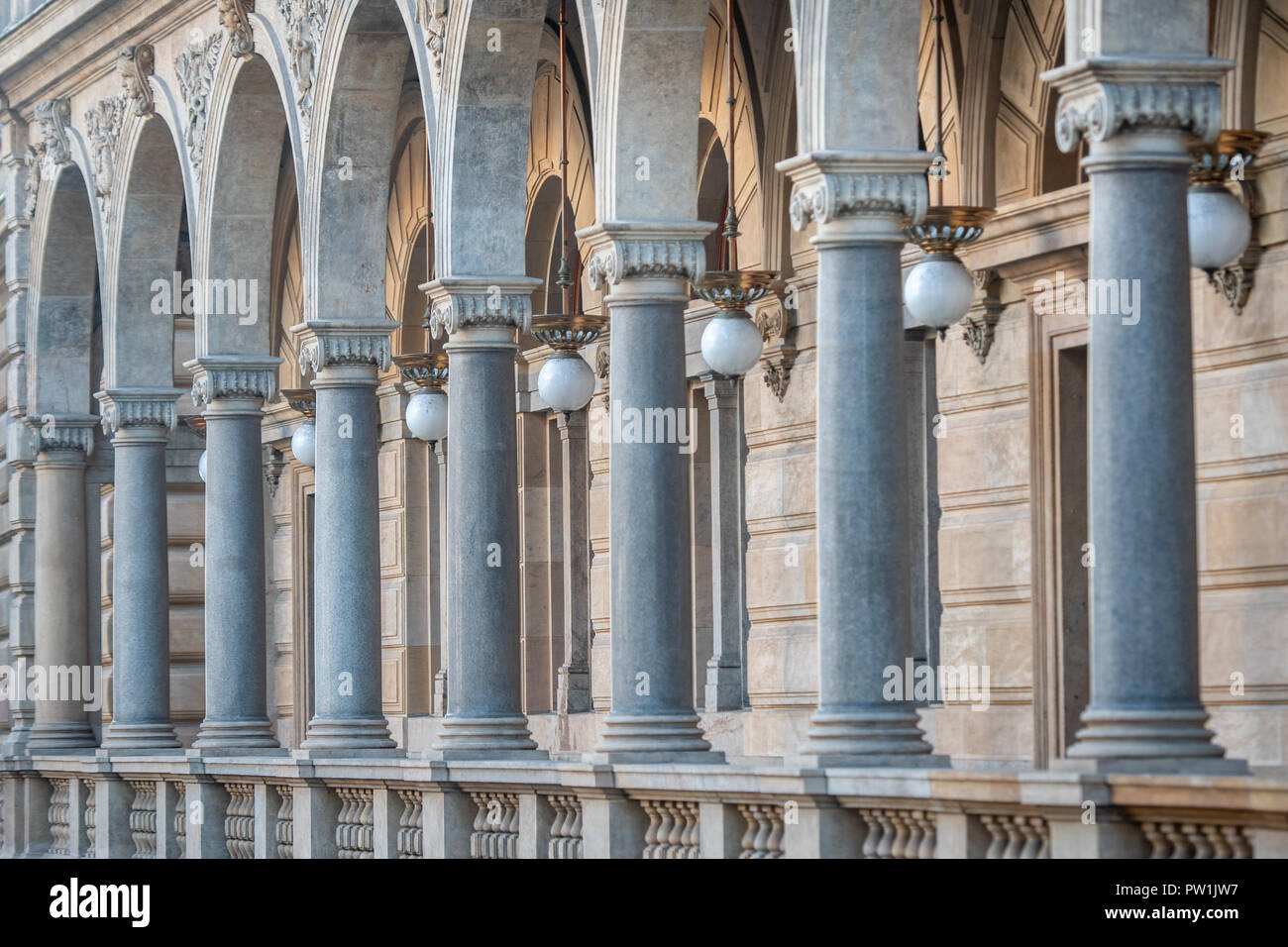 Side view of historical gothic style building, with pillars and lamps ...