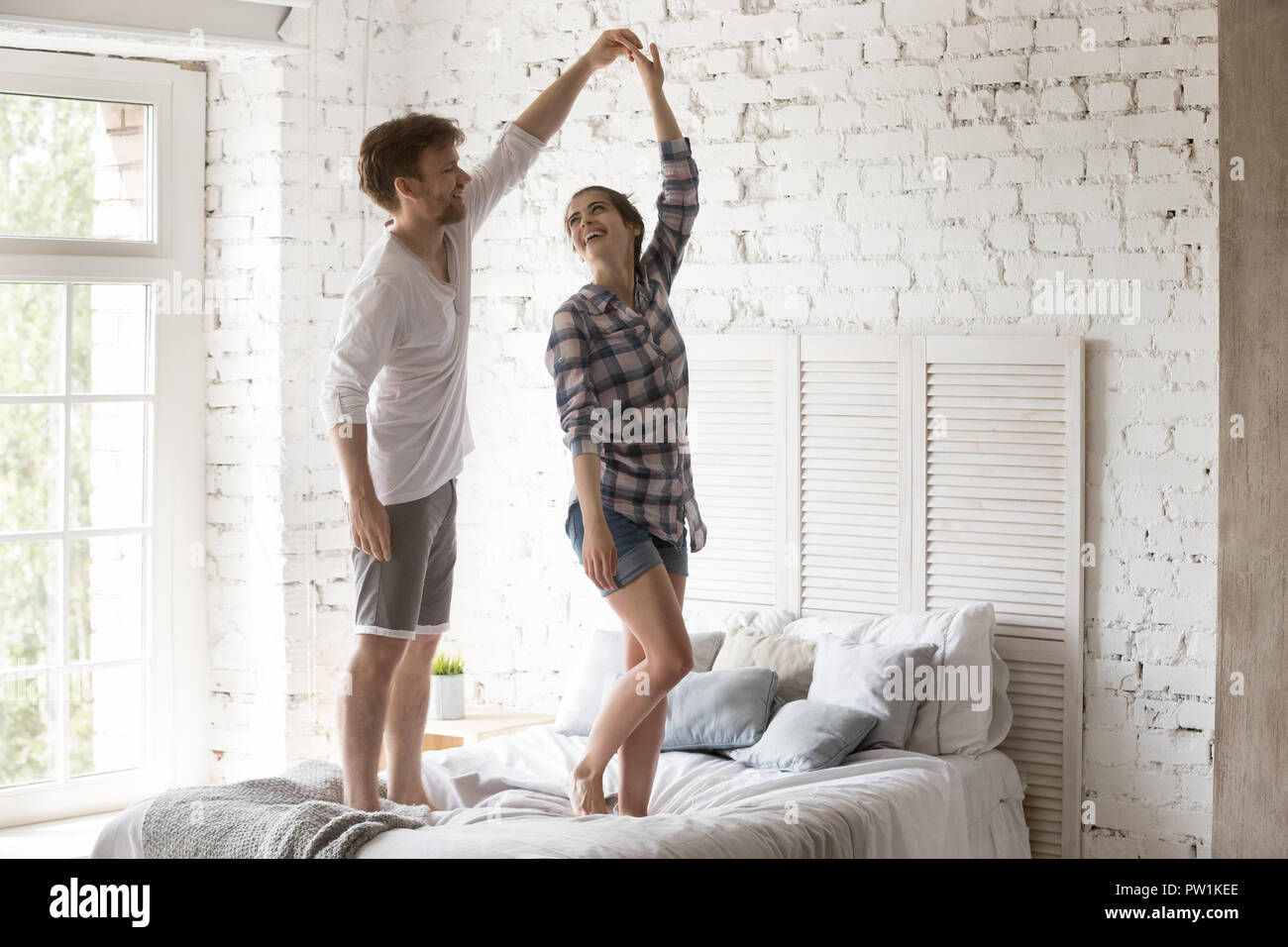 Couple in bed having fun hi-res stock photography and images - Alamy