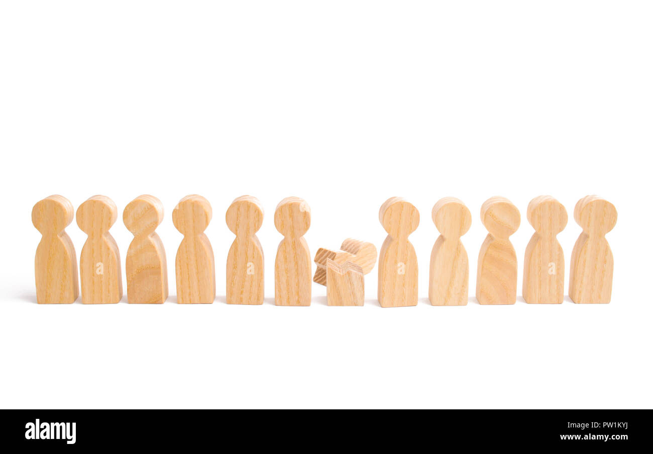 Weak player, worker for dismissal. A row of wooden people and a broken ...