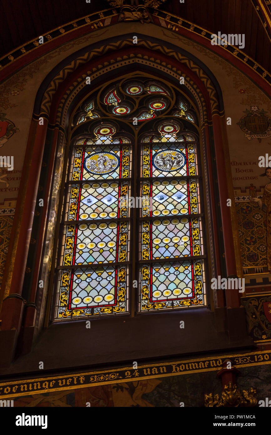 Tall french window with intricate design in the gothic hall in Bruges ...