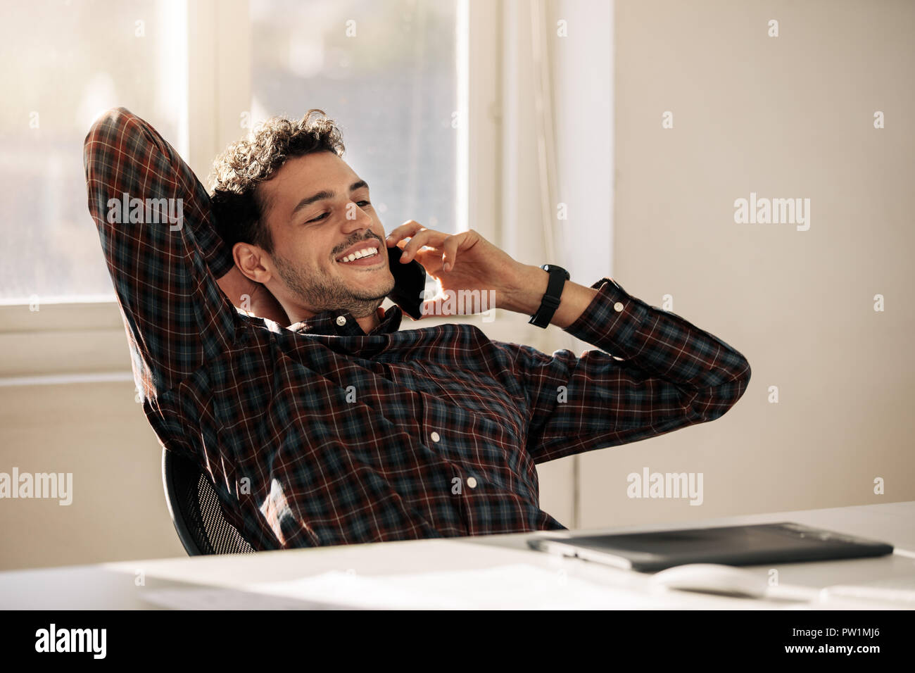 Businessman desk office leaning back hi-res stock photography and ...