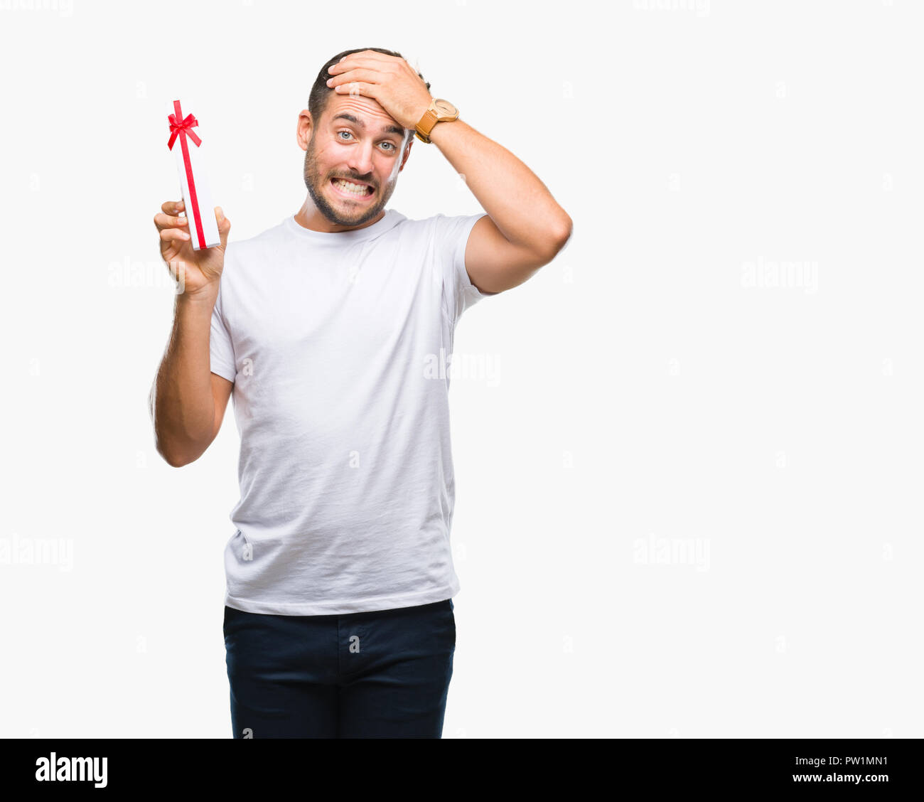 Young handsome man in love giving valentine present over isolated ...