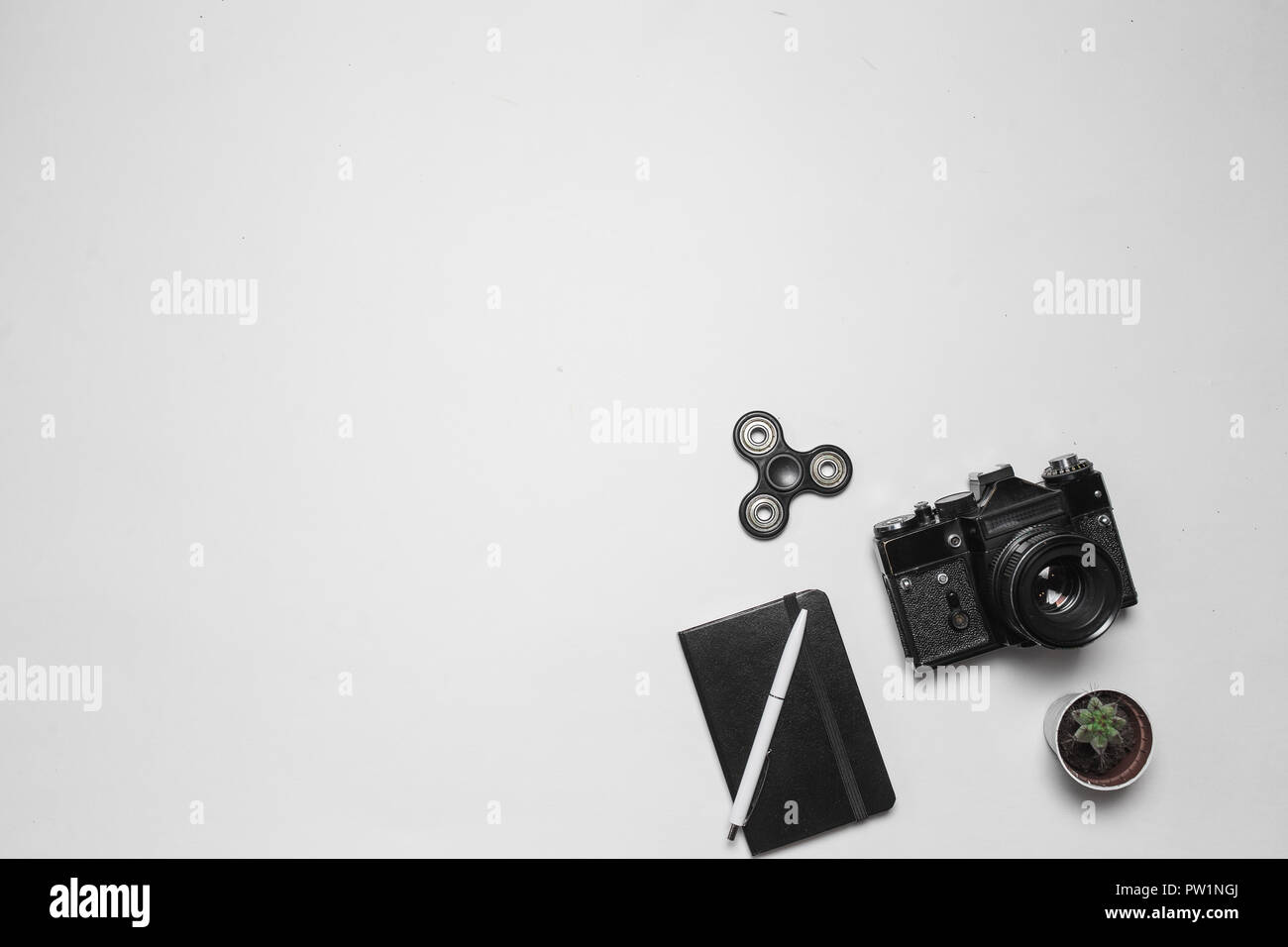 Minimal composition with vintage retro camera, diary with pen and ...