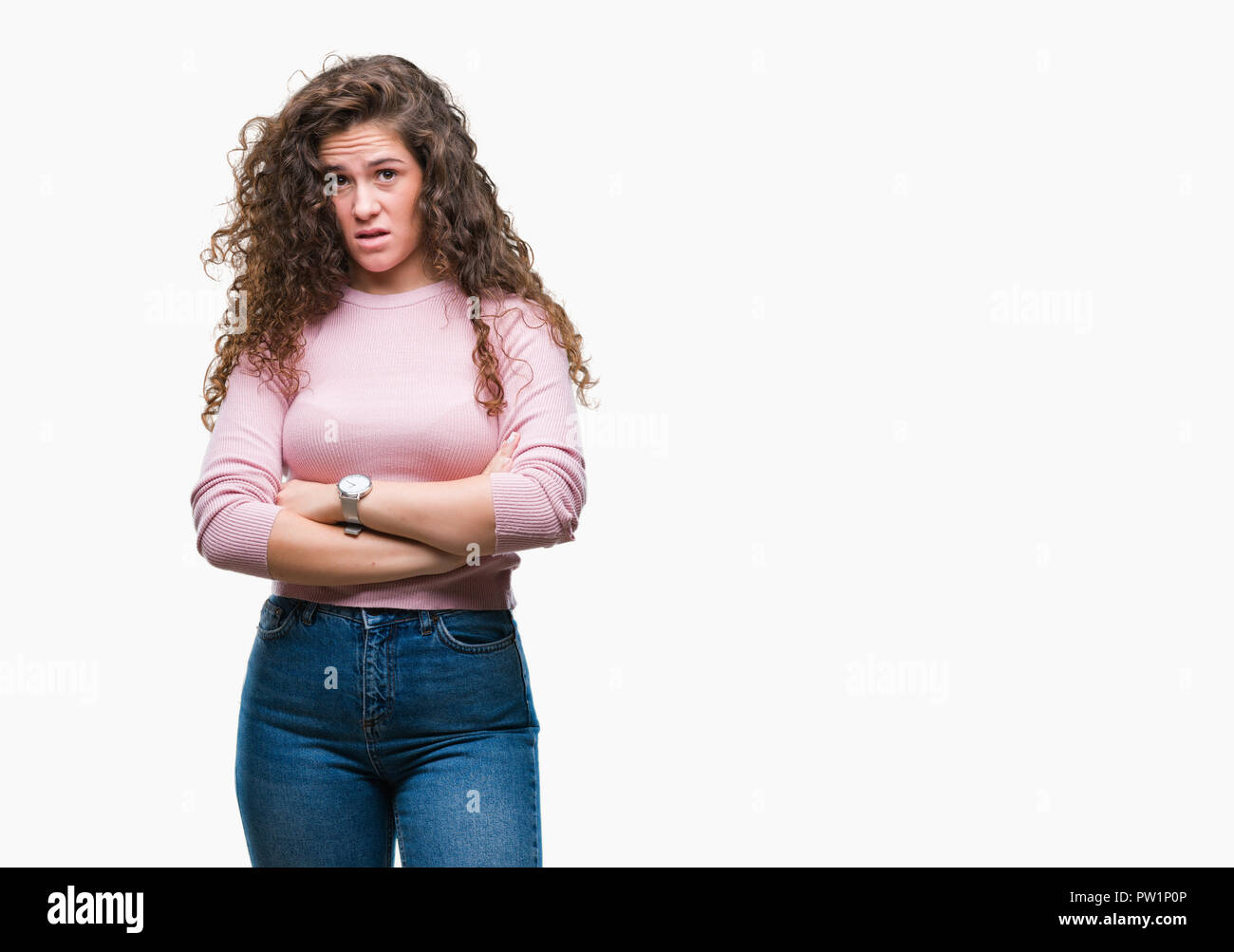 Beautiful brunette curly hair young girl wearing pink sweater over ...