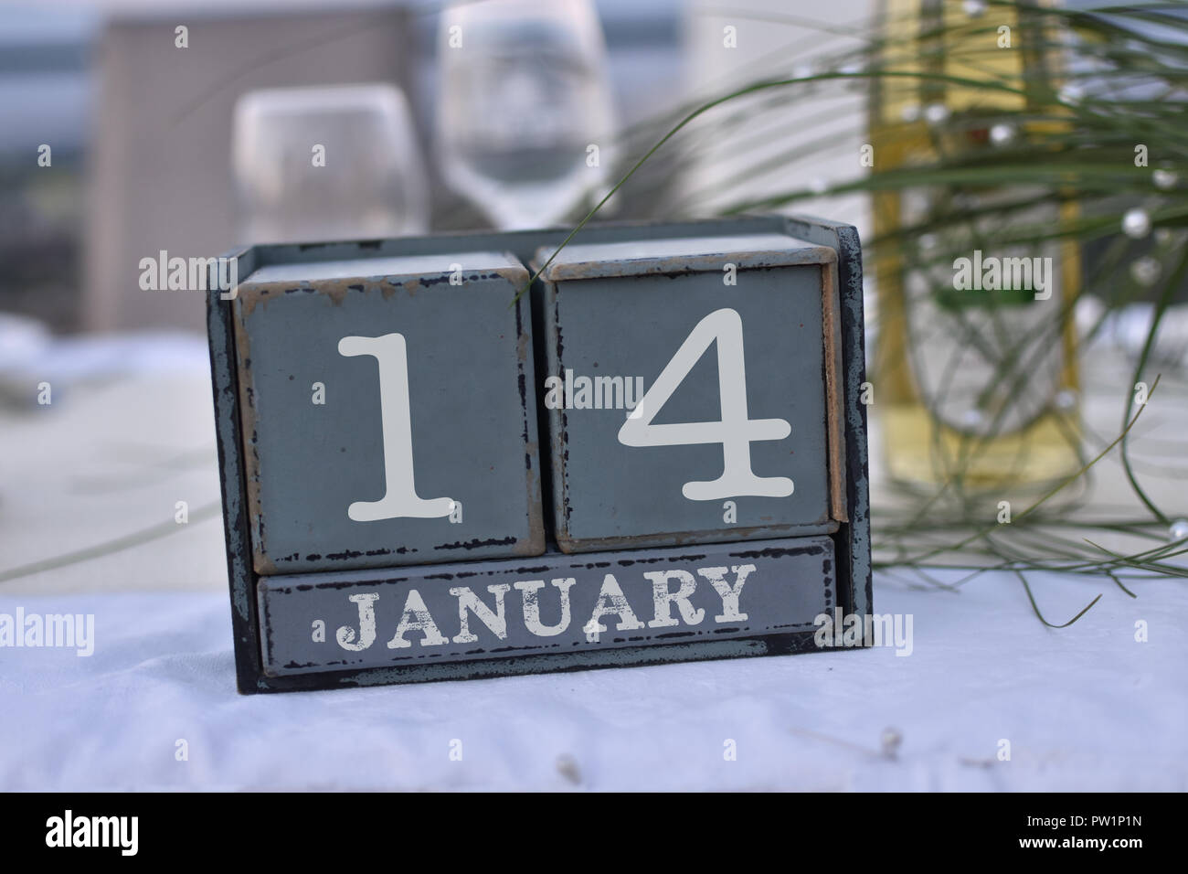 Wood blocks in box with date, day and month 14 January. Wooden blocks ...