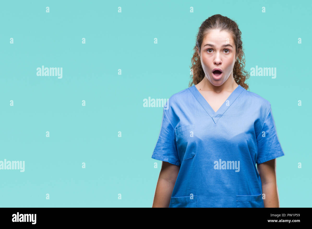 Young brunette doctor girl wearing nurse or surgeon uniform over ...