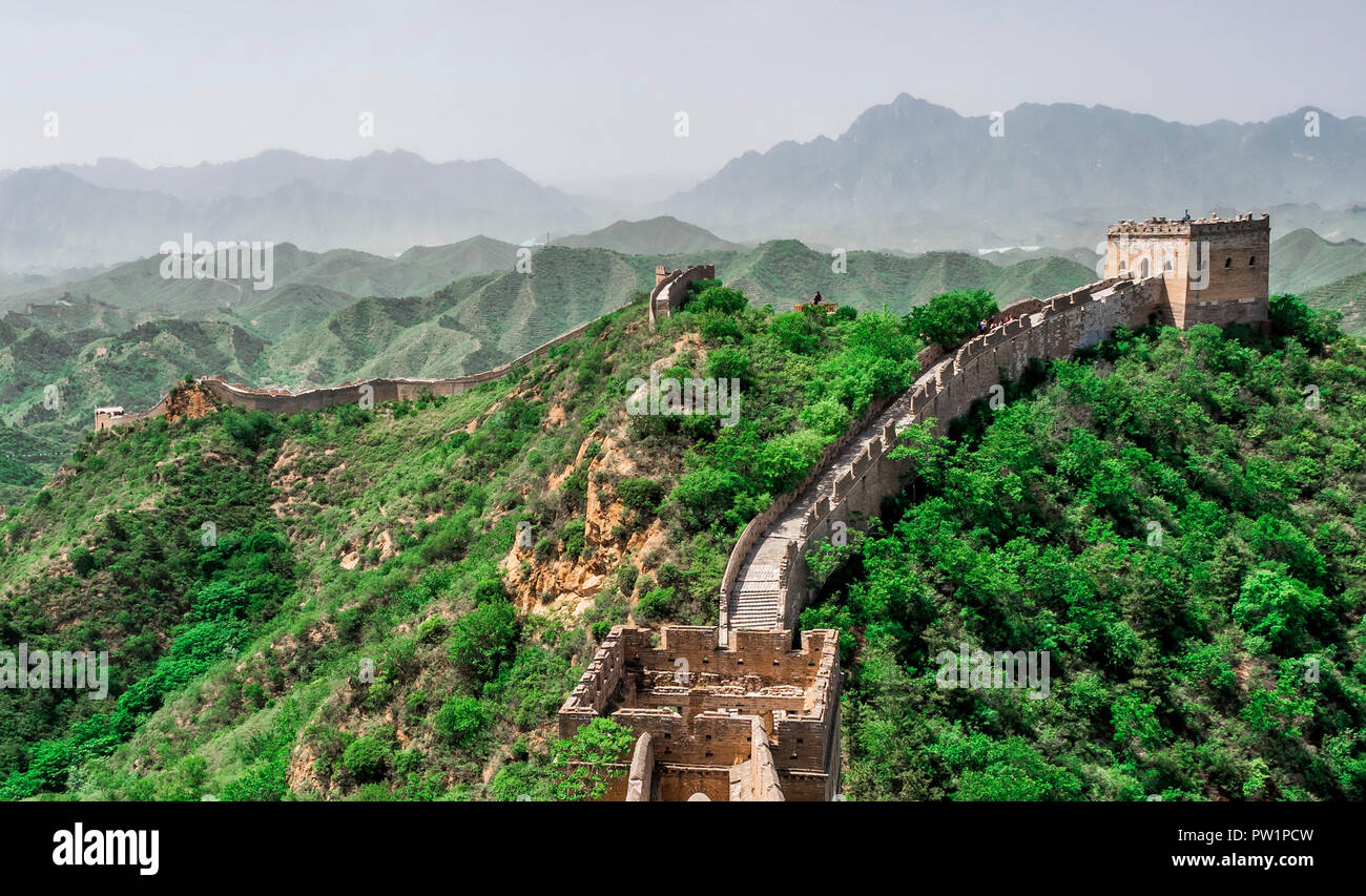The Great Wall Jinshanling section with green trees in a sunny day ...