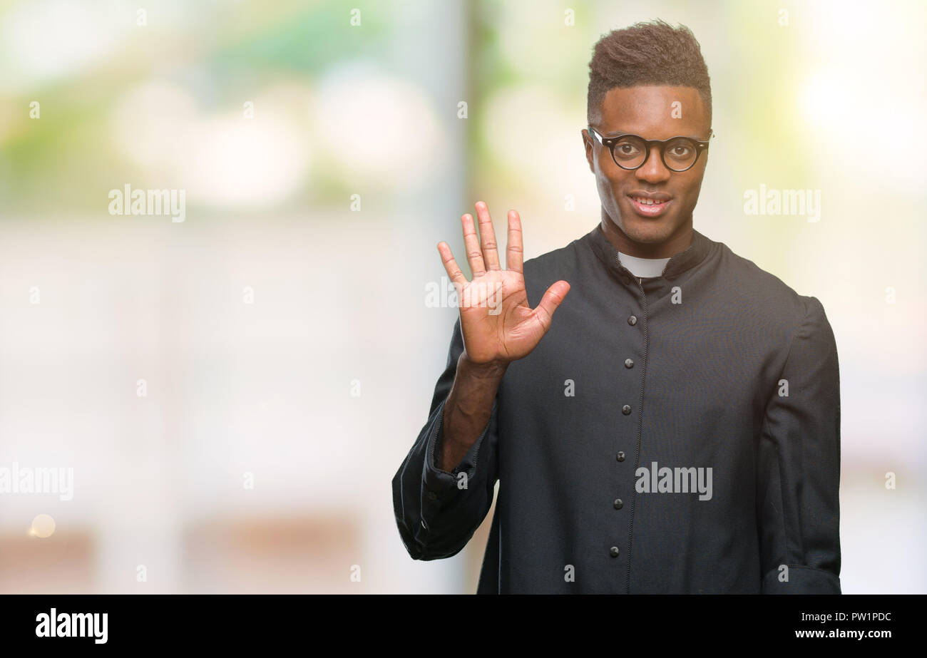 Young african american priest man over isolated background showing and ...