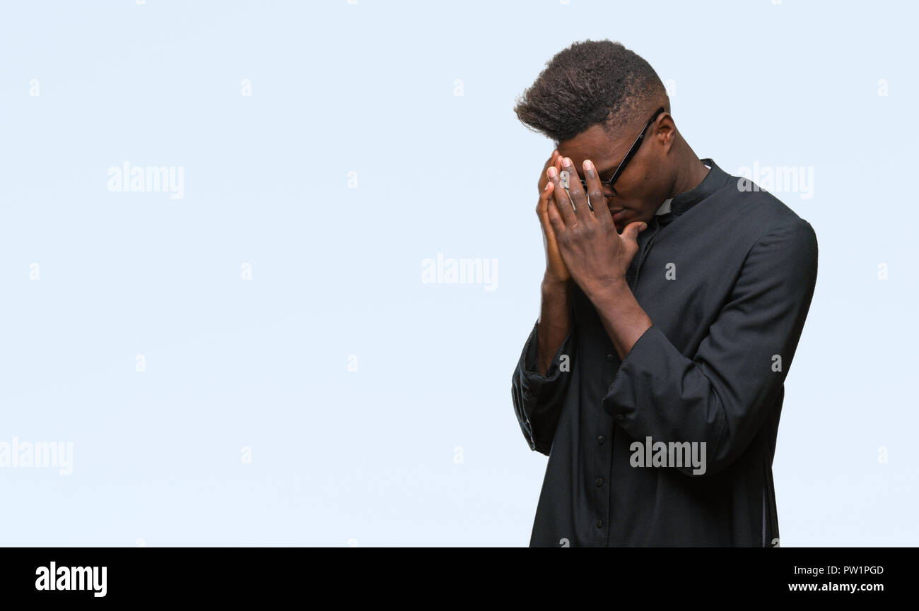 Young african american priest man over isolated background with sad ...