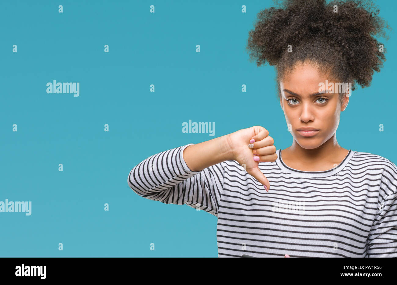 Young afro american woman texting using smartphone over isolated ...