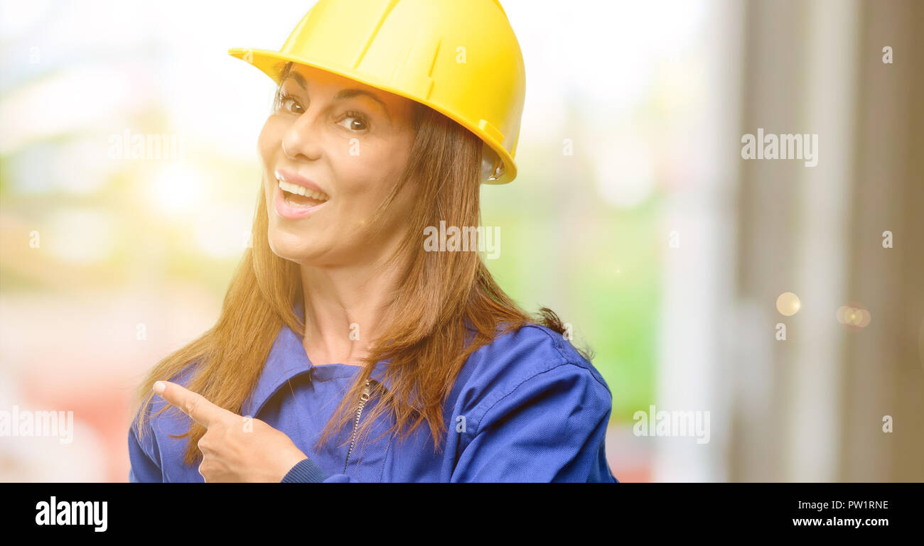 Engineer construction worker woman pointing away side with finger Stock ...