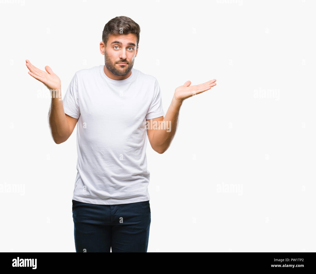 Young handsome man over isolated background clueless and confused ...