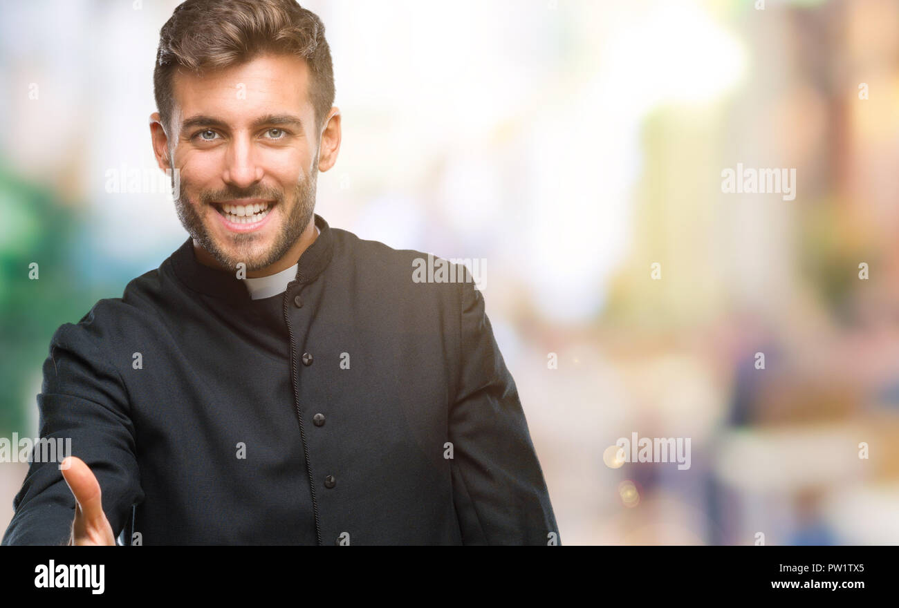 Priest shake hand boy hi-res stock photography and images - Alamy