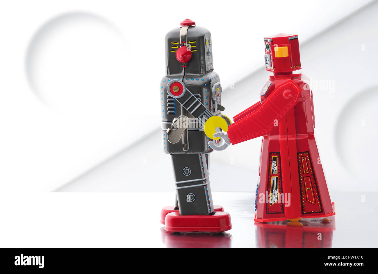 Concept Vintage Metal Toy Robot Holding Hands, Falling in Love, Robot ...