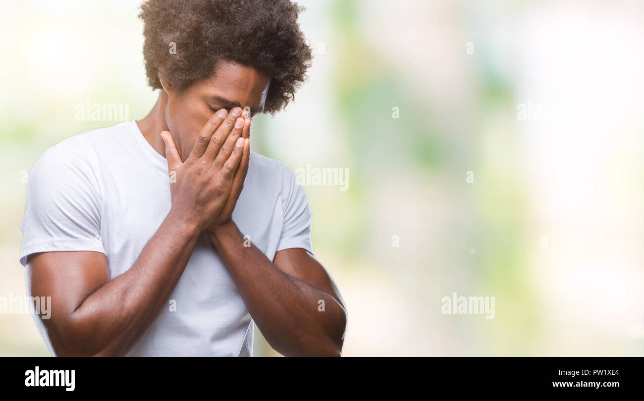Afro american man over isolated background with sad expression covering ...