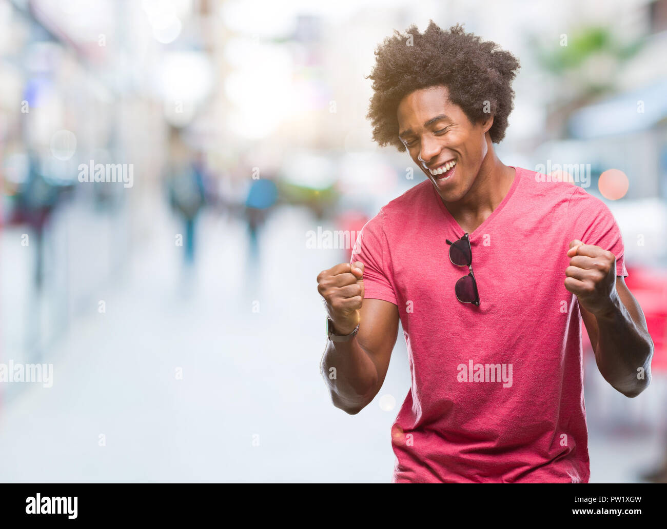 Afro american man over isolated background very happy and excited doing ...