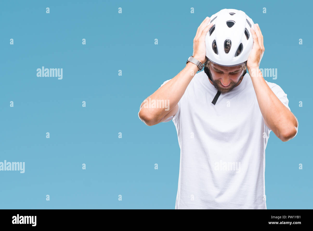 Handsome hispanic cyclist man wearing safety helmet over isolated ...
