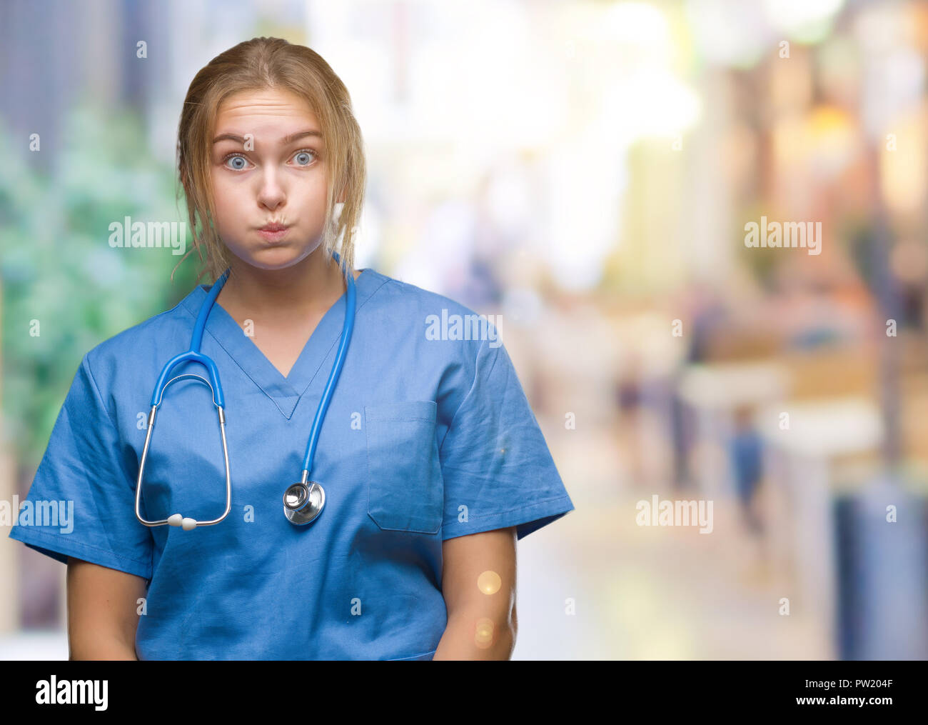 Young caucasian doctor woman wearing surgeon uniform over isolated ...
