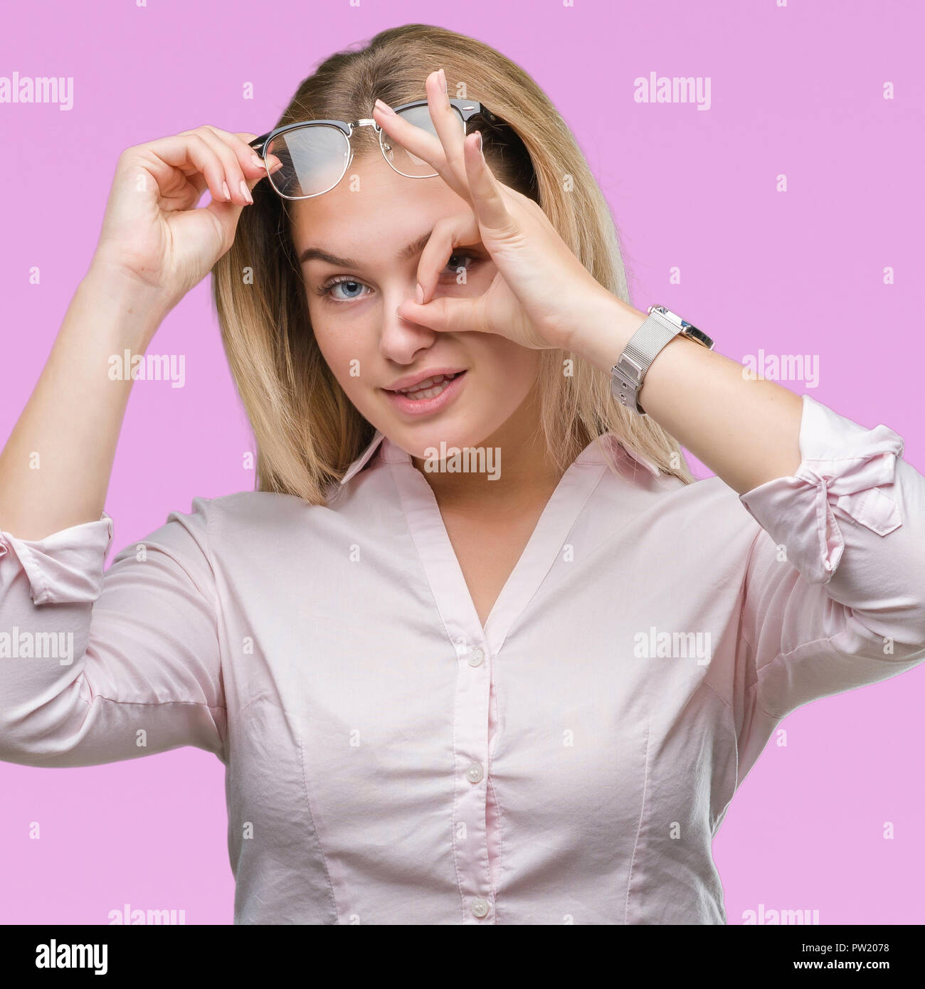 Young caucasian business woman wearing glasses over isolated background ...