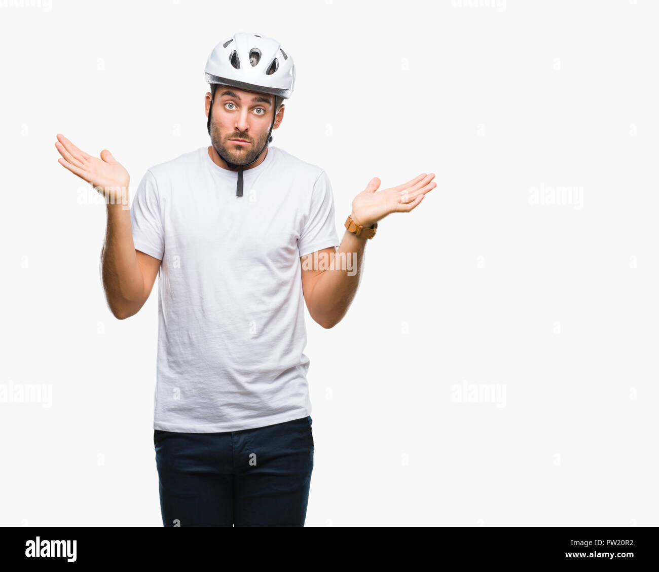 Young handsome man wearing cyclist safety helmet over isolated ...