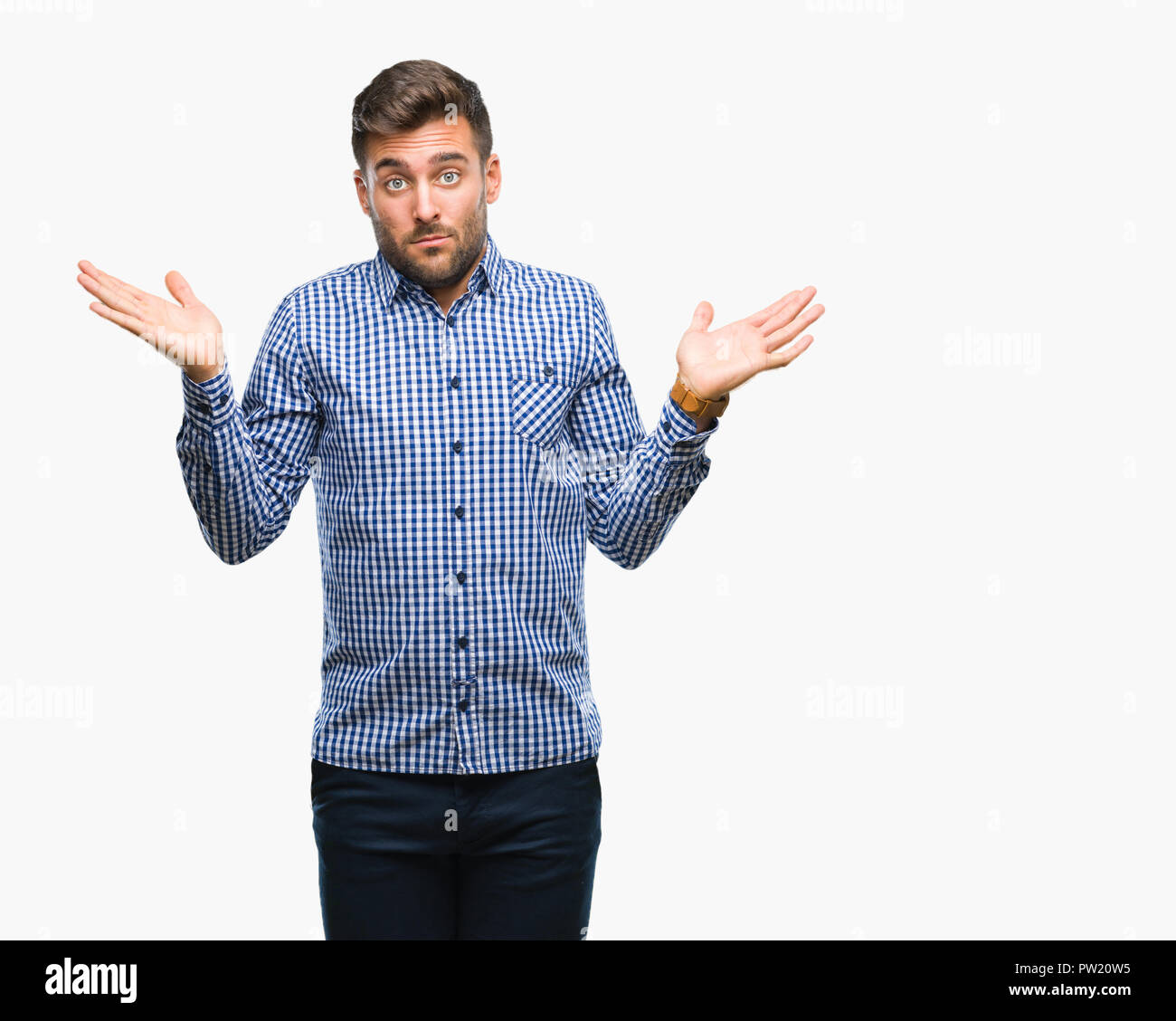 Young handsome man over isolated background clueless and confused ...