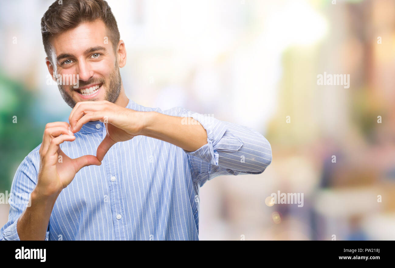 Young handsome man over isolated background smiling in love showing ...