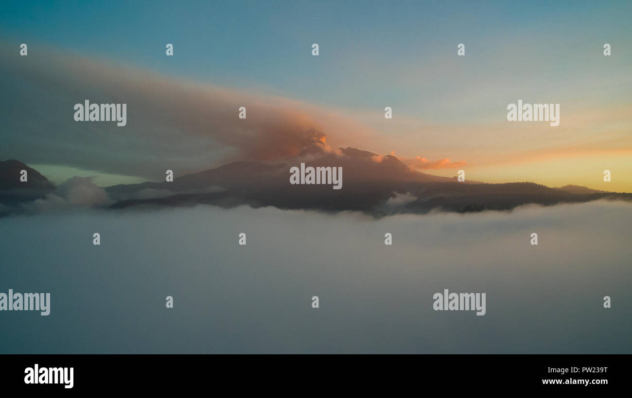 Calbuco volcano with volcanic activity and an ash plume, at sunset ...