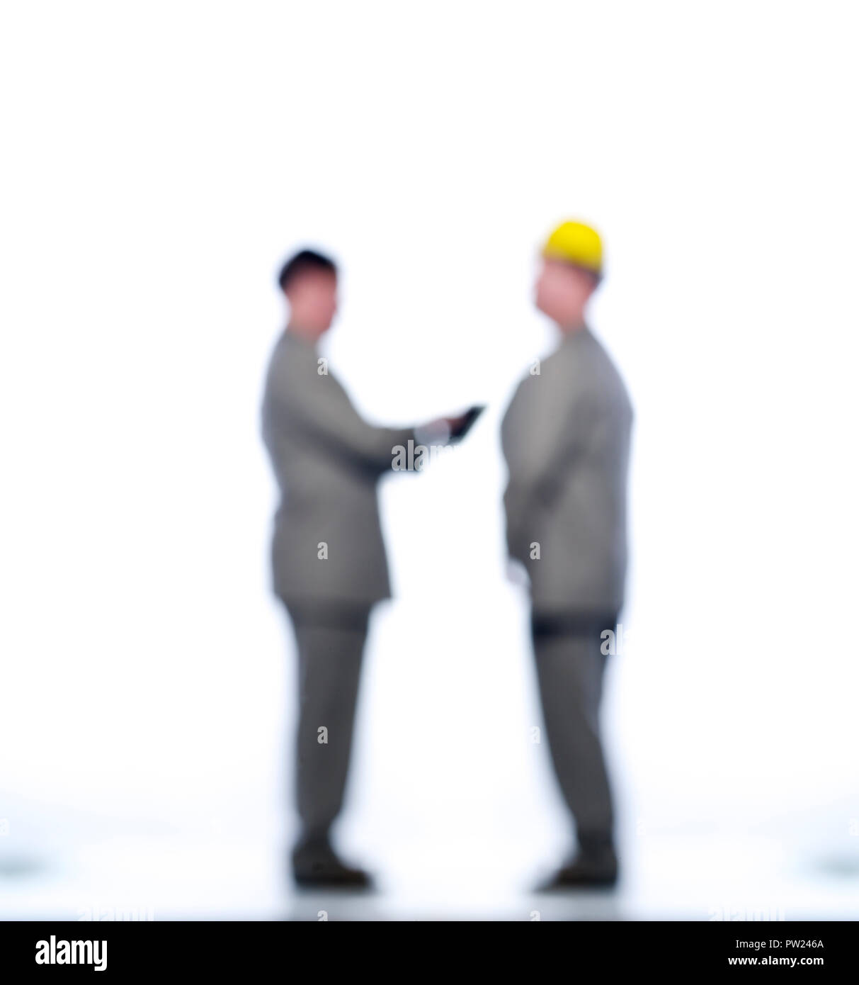 Concept Two 2 Men's in Business Suits and Hard Hat Discussing Work ...