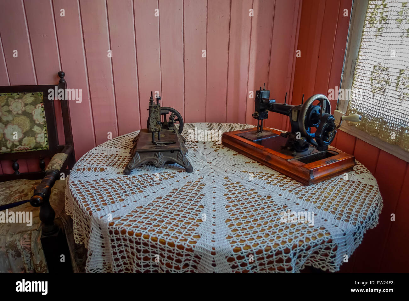 Inside view of old sewing machine over a wooden table at Chonchi museum ...