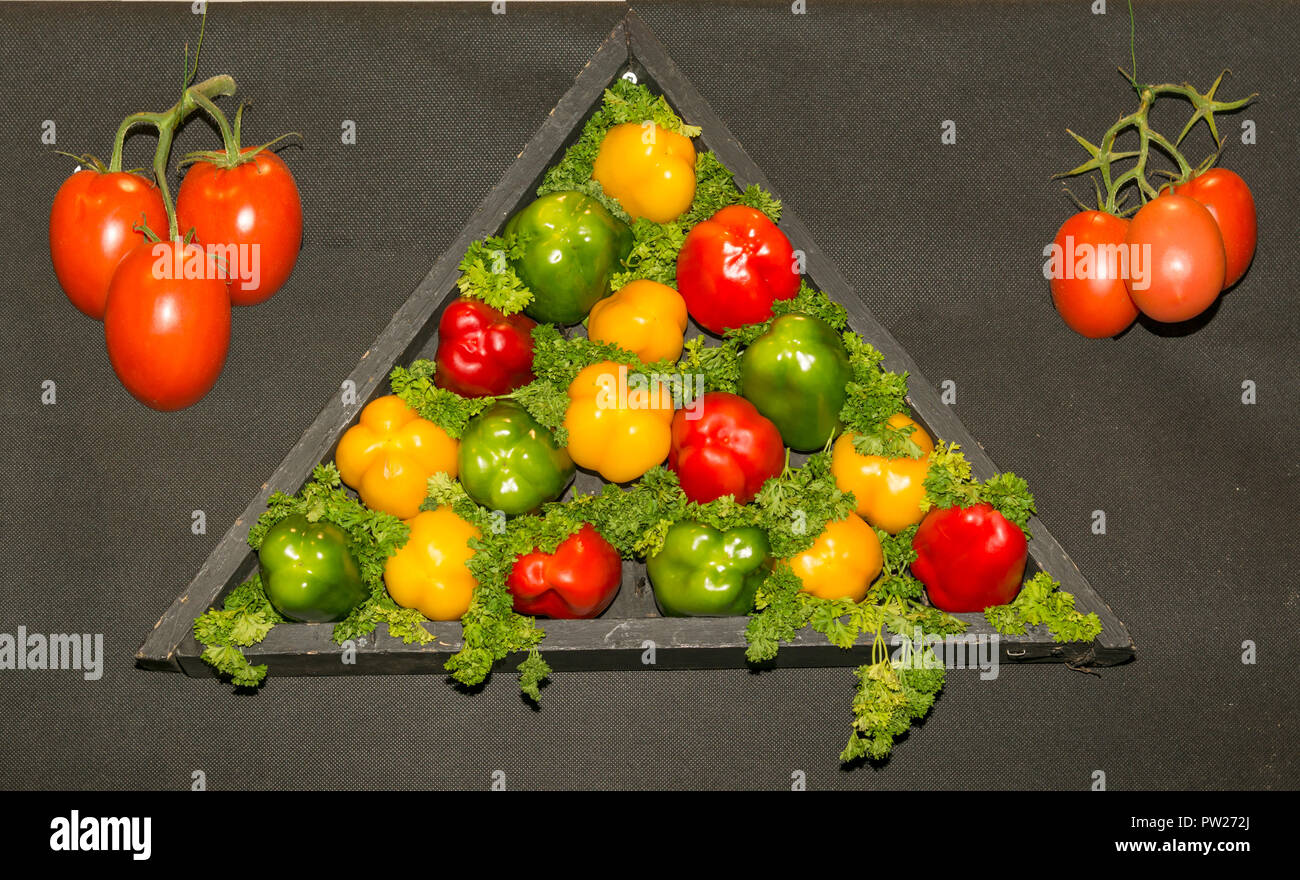 Red, Green & Yellow Peppers in a triangle Stock Photo - Alamy