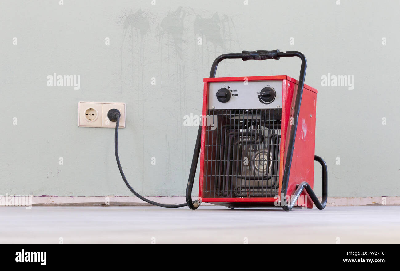 Compact red heater, drying the floor before installing the PVC floor ...
