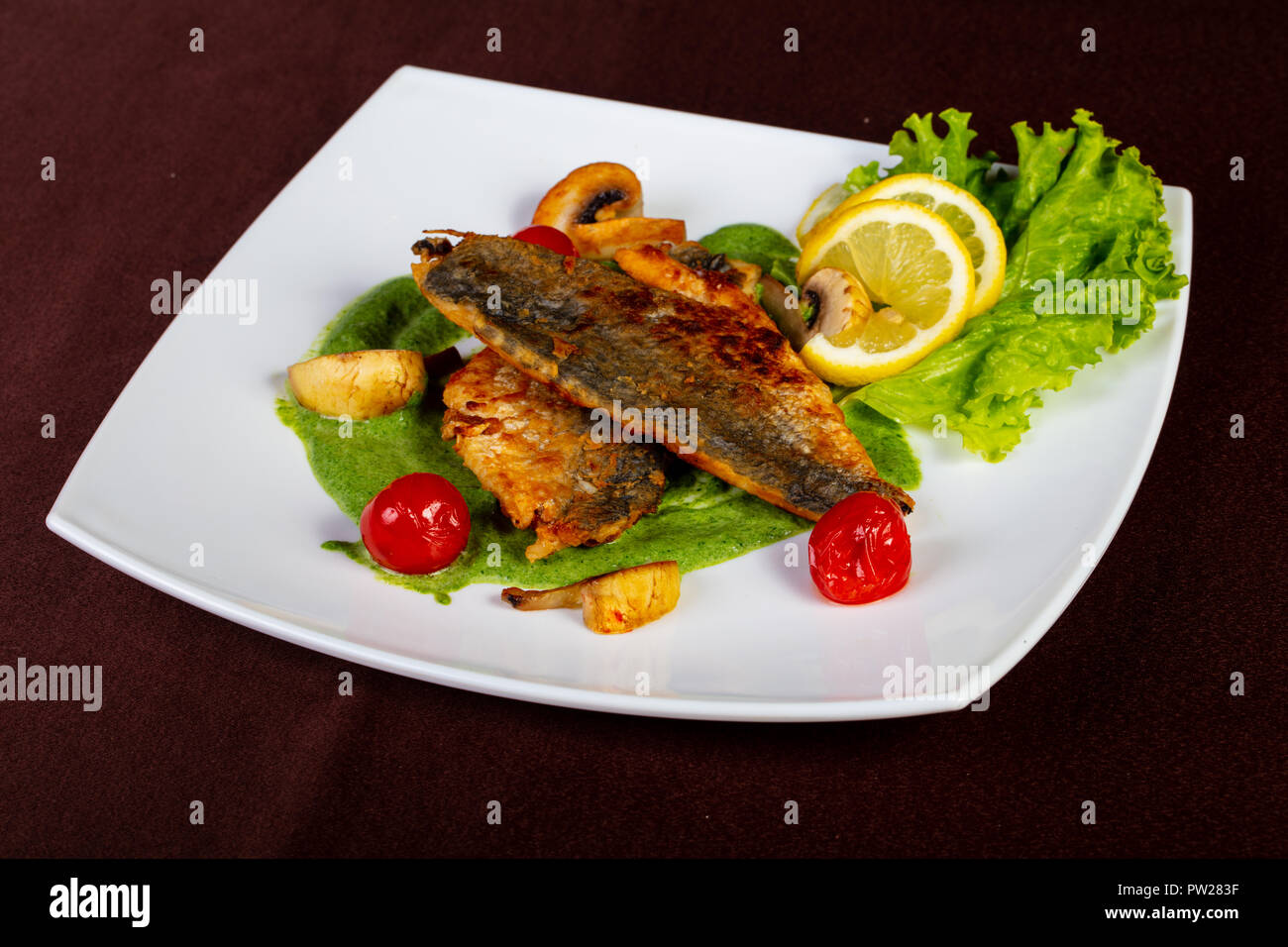 Roasted Dorado fish fillet with sauce Stock Photo - Alamy