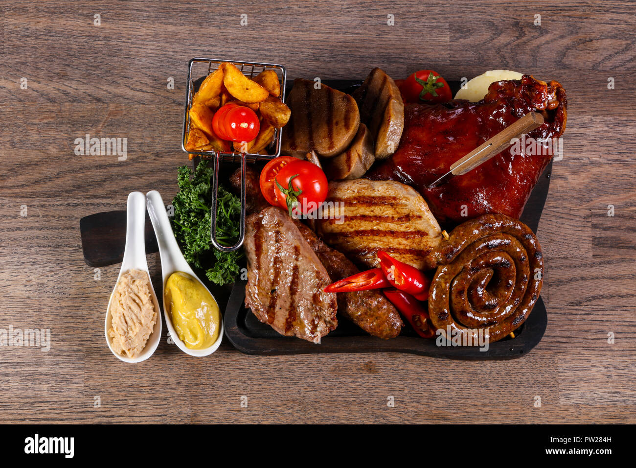 Grilled meat mix plate - beef, pork and chicken Stock Photo - Alamy