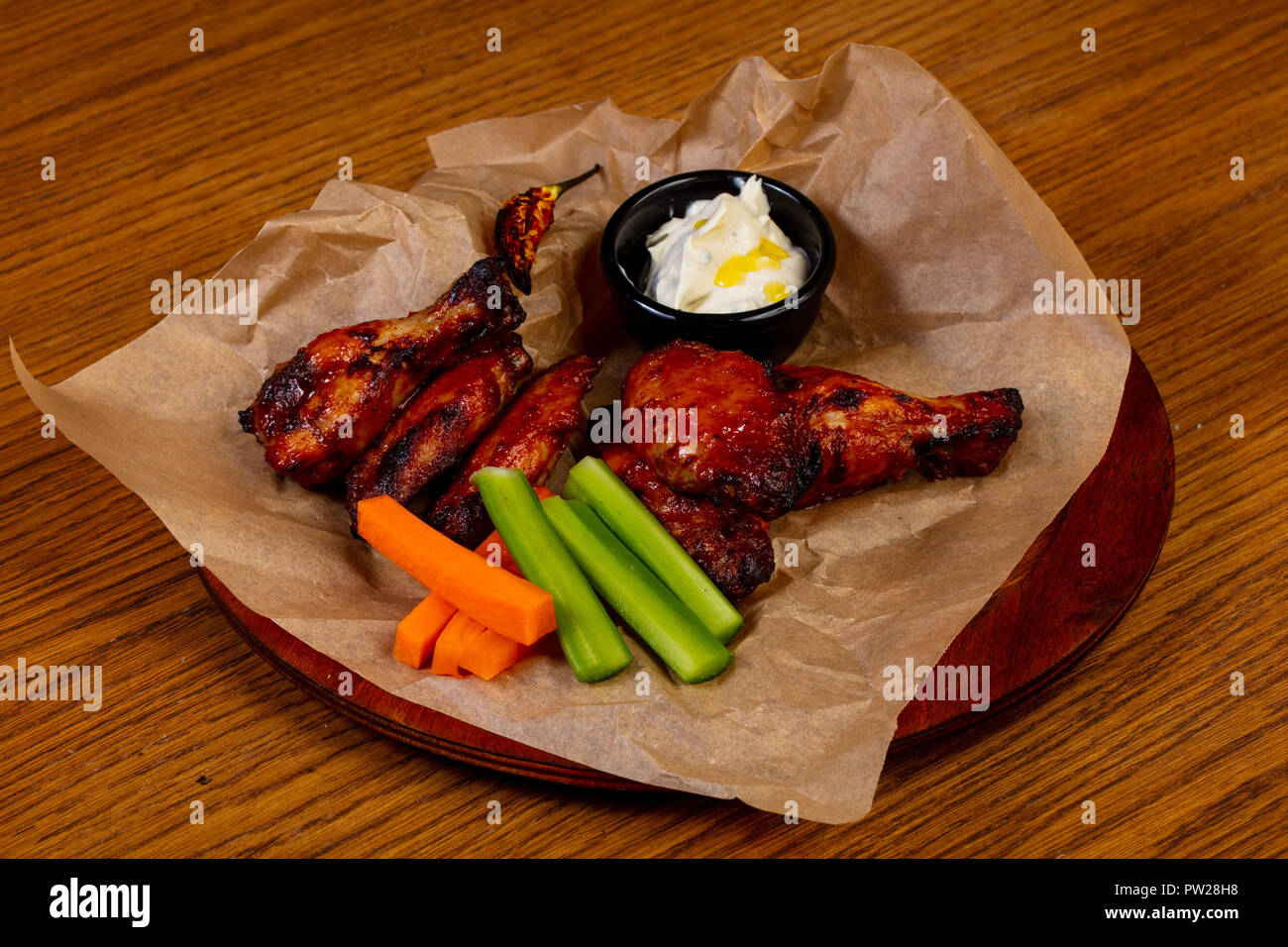 Roasted chicken wings with parsley sticks Stock Photo - Alamy