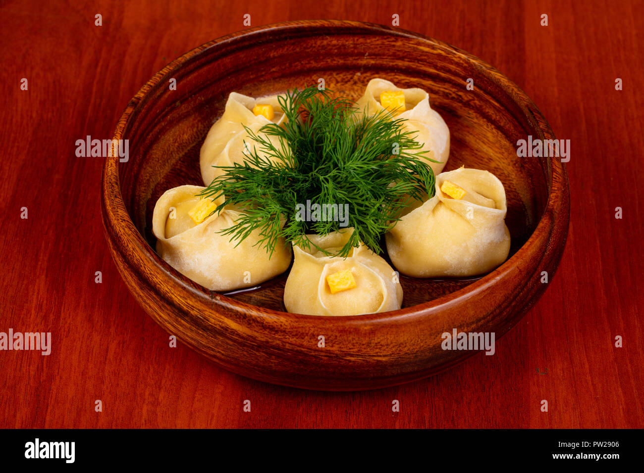 Uzbek traditional dumplings - Manti with meat Stock Photo - Alamy
